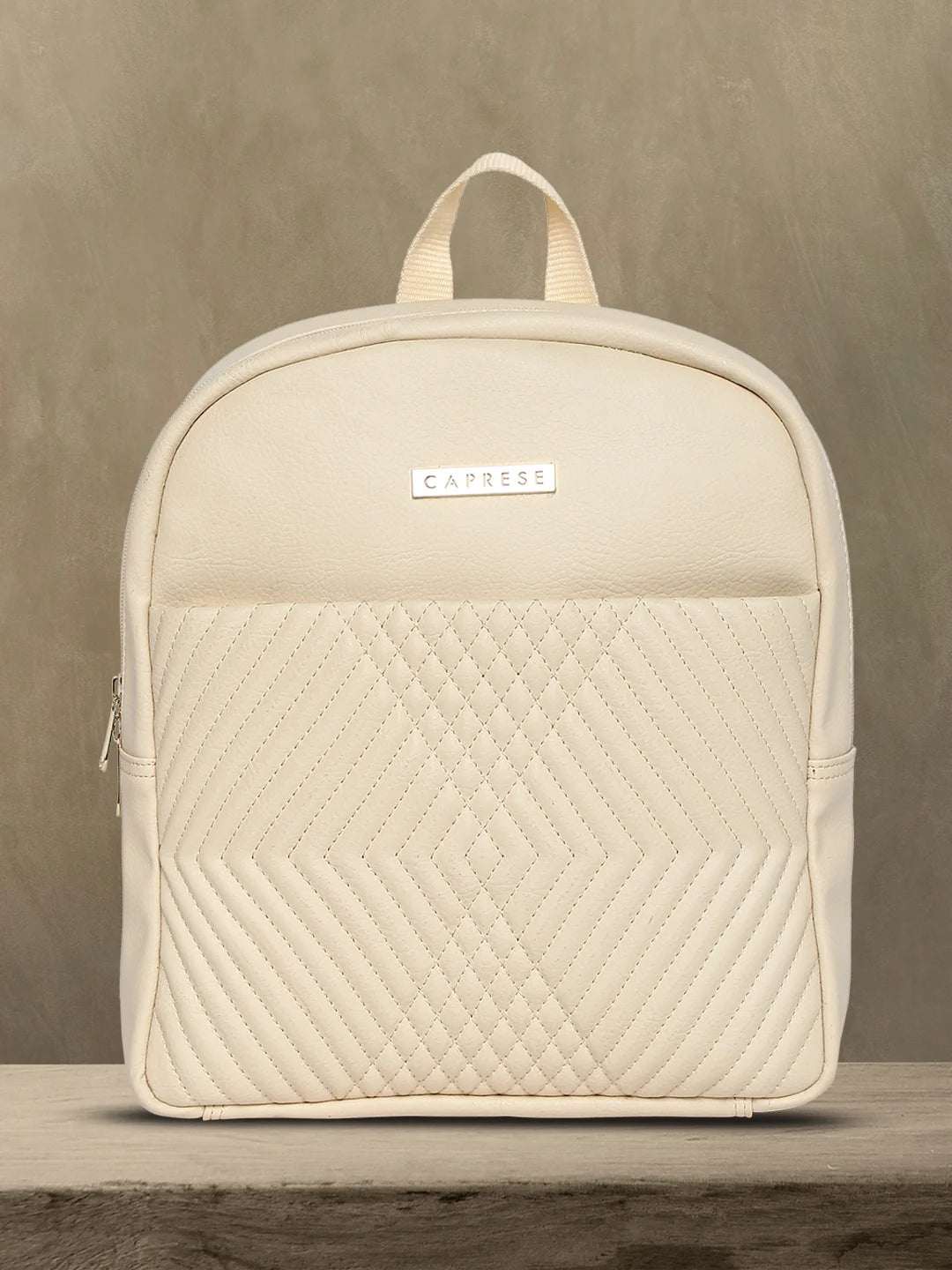 Buy Caprese Leo Medium Cream Backpack @ 1319 | Caprese Bags