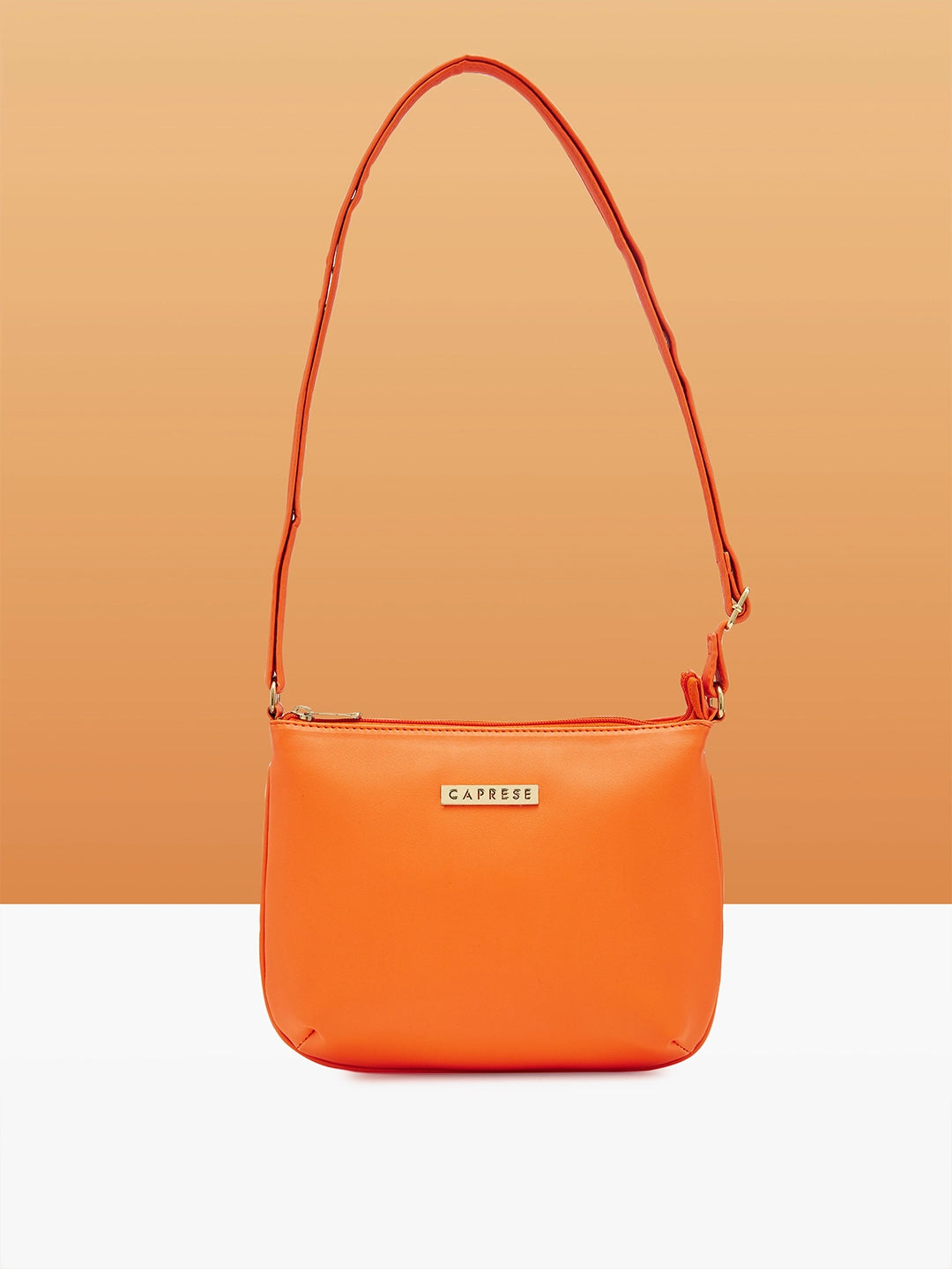 Buy Caprese Shyla Small Orange Sling @ Rs.644 | Caprese Bags
