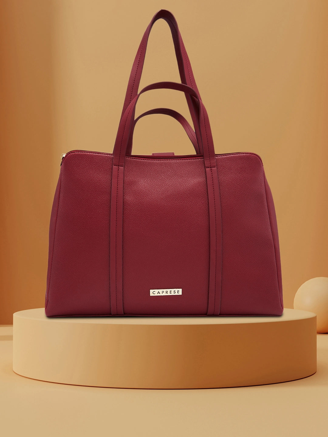 Buy Caprese Jamie Medium Maroon Satchel Bag @ Rs.4999 | Caprese Bags